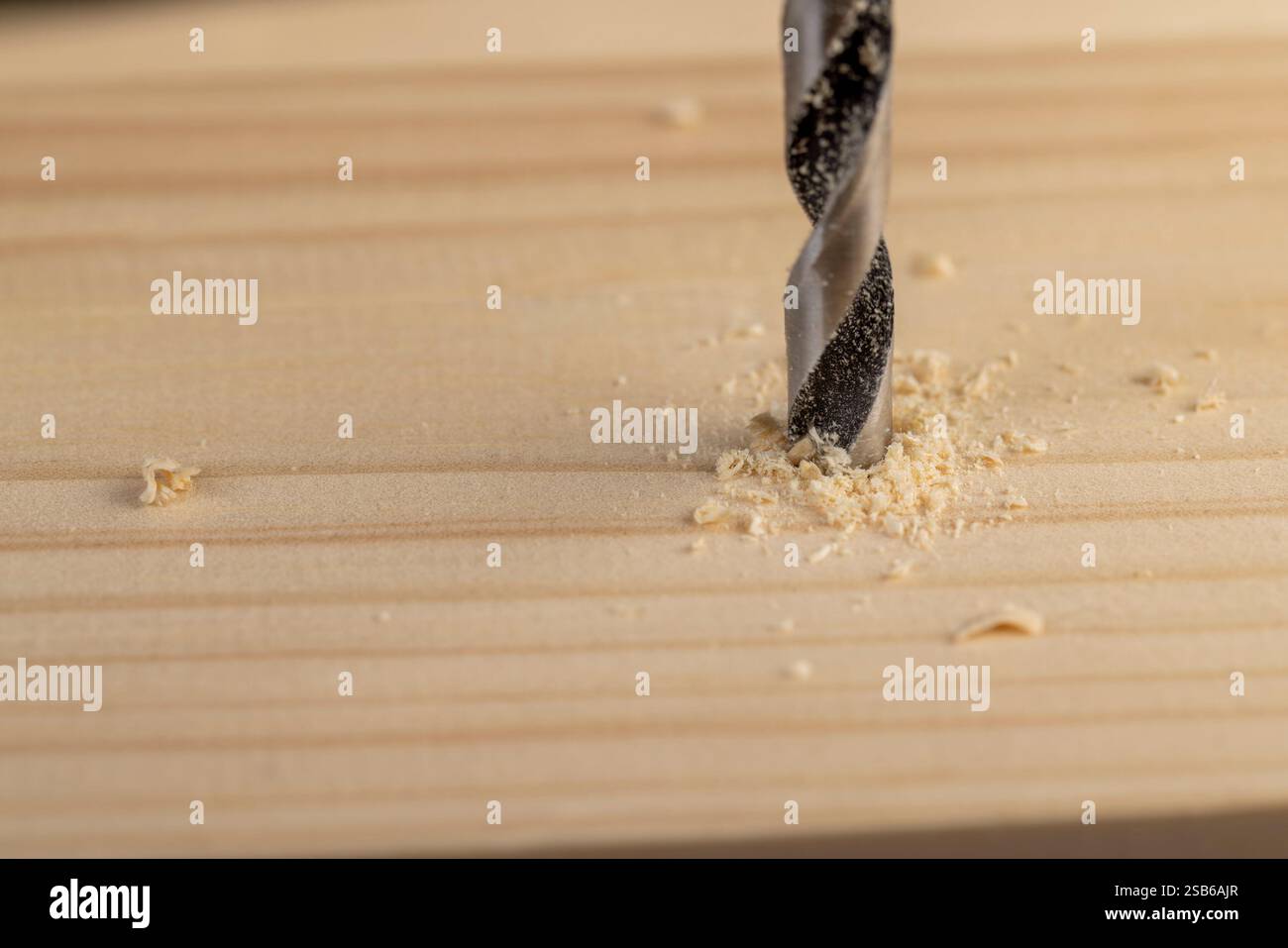 pine wood board during operation, pine wood with sawdust after drilling ...