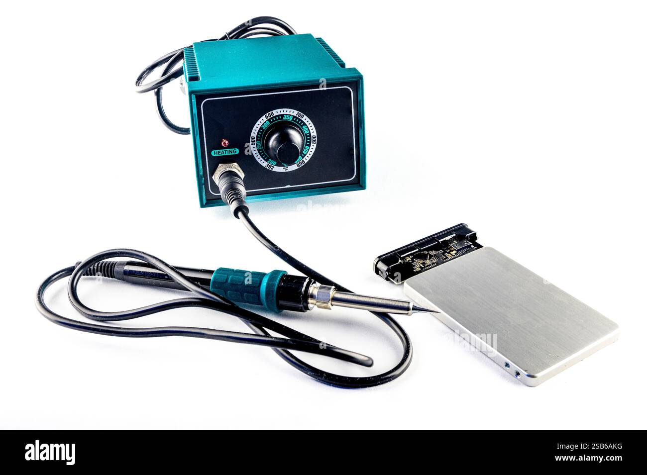 Damaged external drive, transformer soldering iron on white background ...