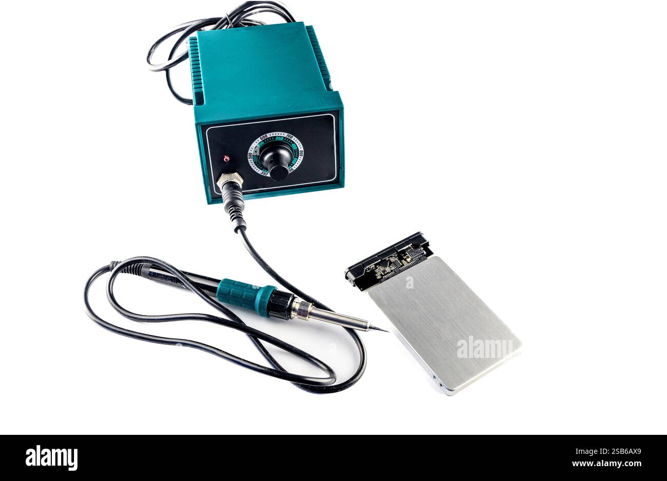 Damaged external drive, transformer soldering iron on white background ...
