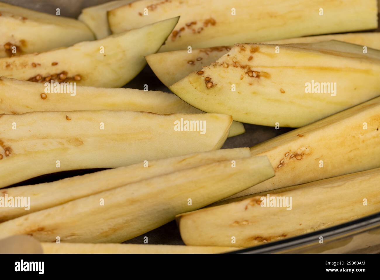 cut lengthwise ripe eggplant during cooking, the flesh of sliced ripe ...