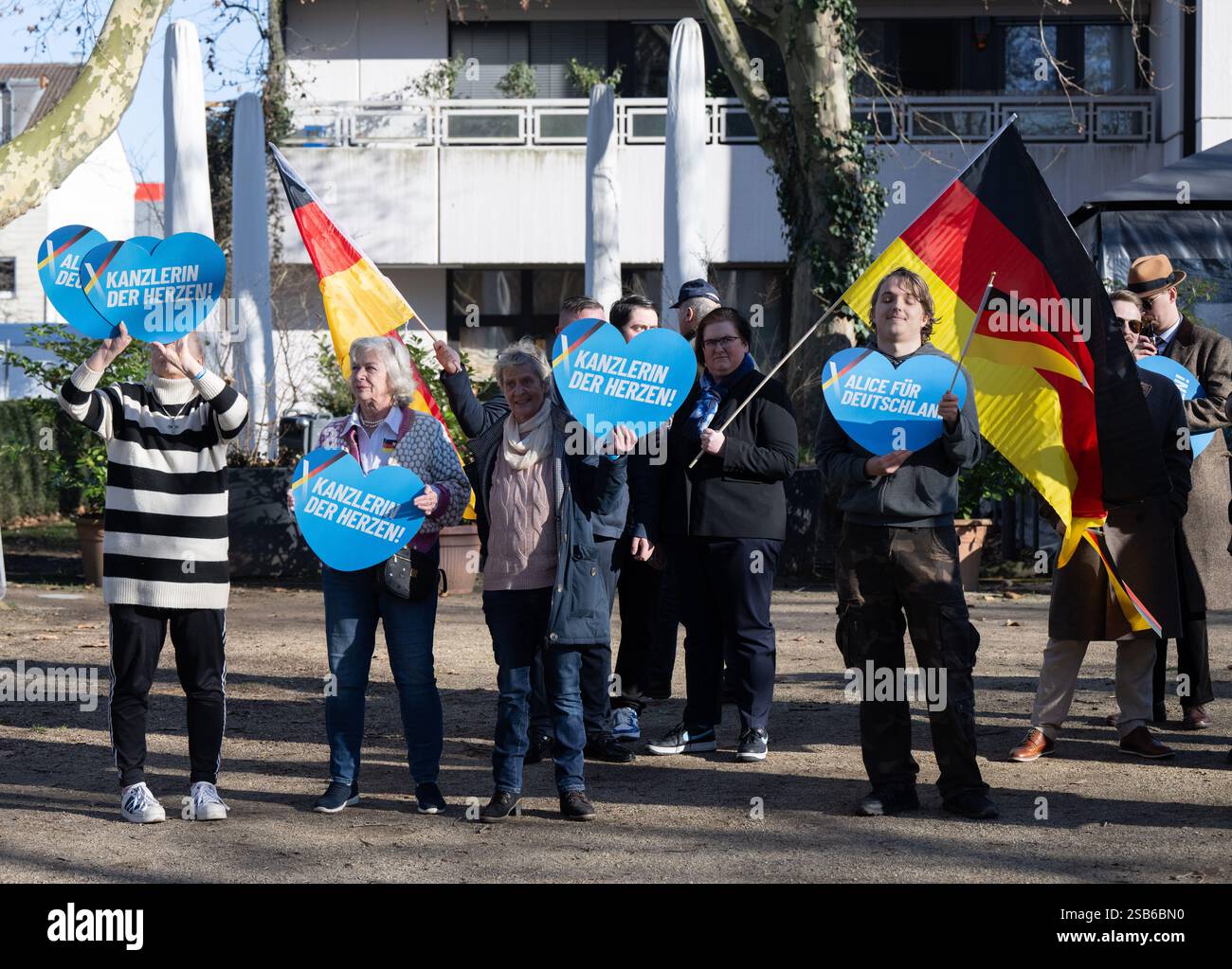 Neu Isenburg, Germany. 01st Feb, 2025. Pro-AfD demonstrators stand in ...