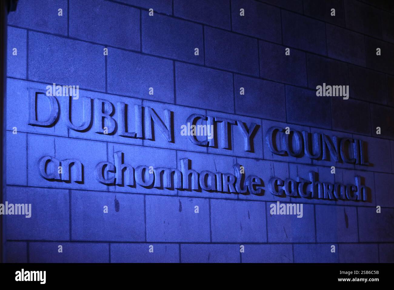 Dublin, Ireland - 28th January 2025 - a large blue lit sign in stone ...
