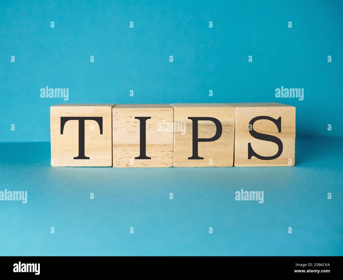Wooden block with the word tips written on it. The blocks are arranged ...