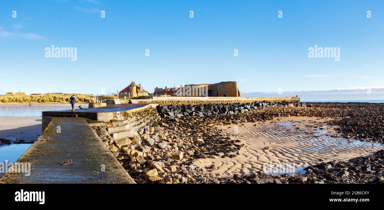 Scenic panoramic view of rocky coastal area with historic kilns and a ...
