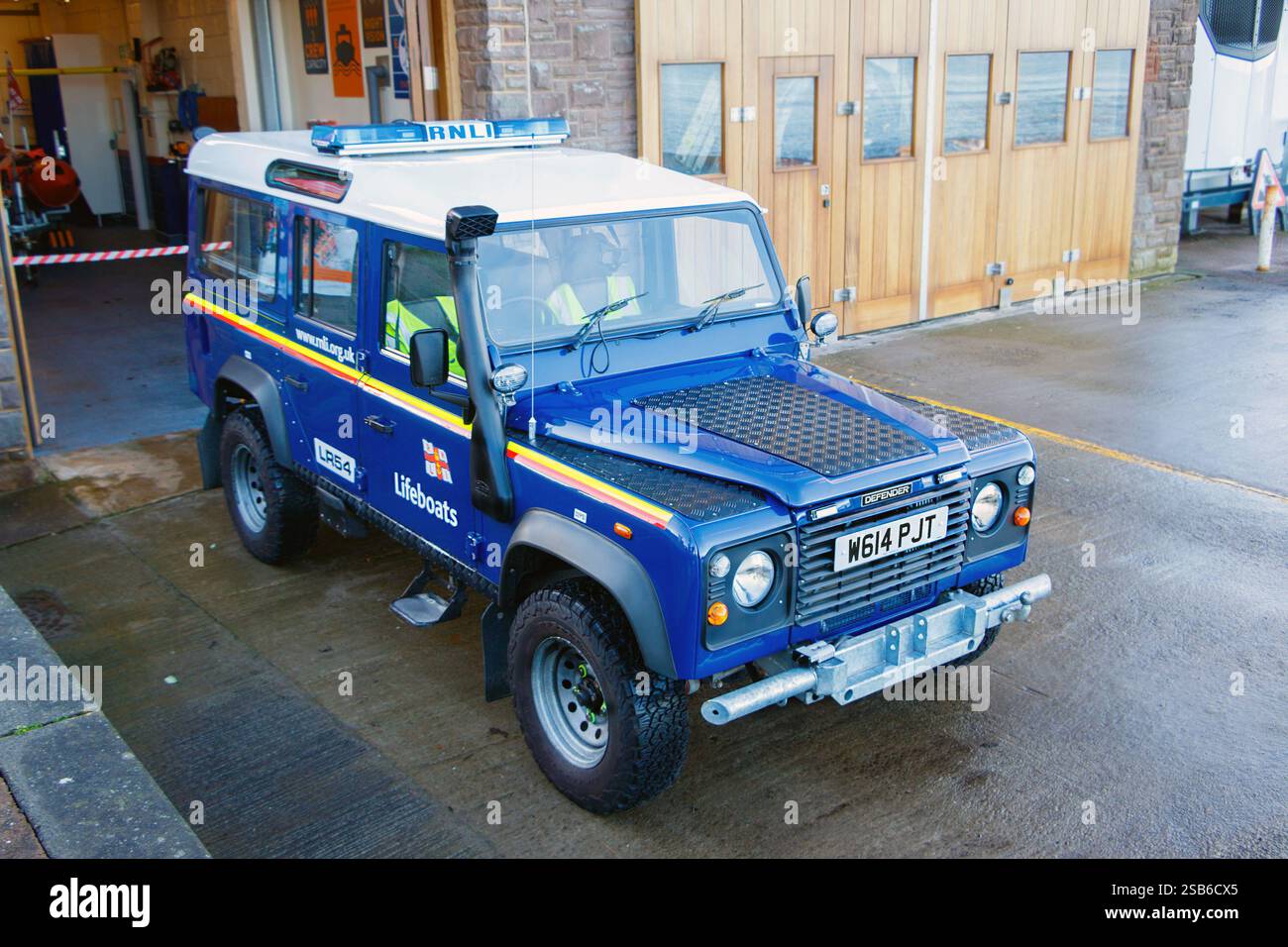 Blue Land Rover used by a lifeboat crew parked outside a lifeboat ...