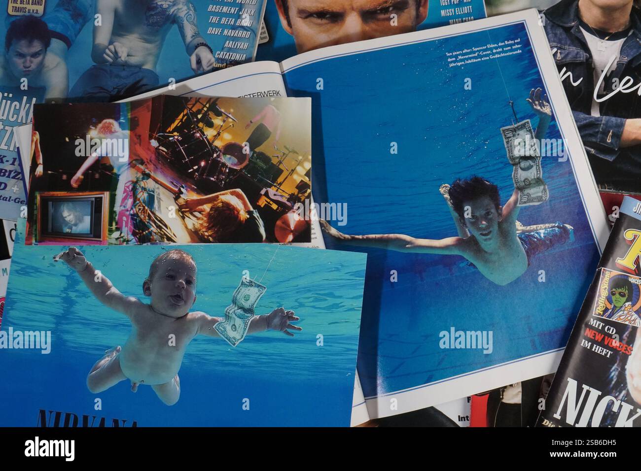 Magazine with Nevermind Cover and Nirvana CD - Grunge Stock Photo - Alamy