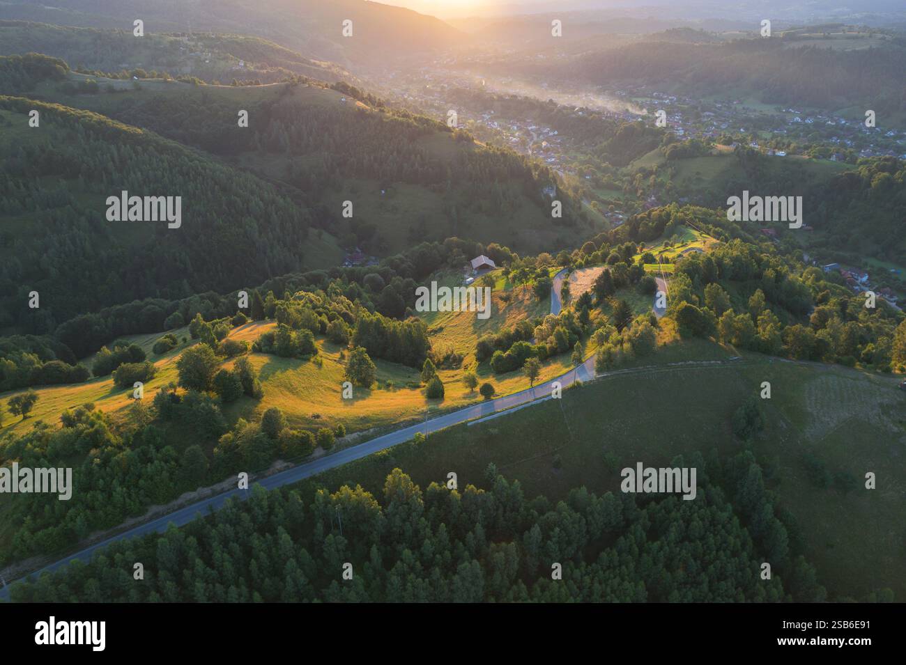 Summer aerial landscape with green hills above the Romanian village ...