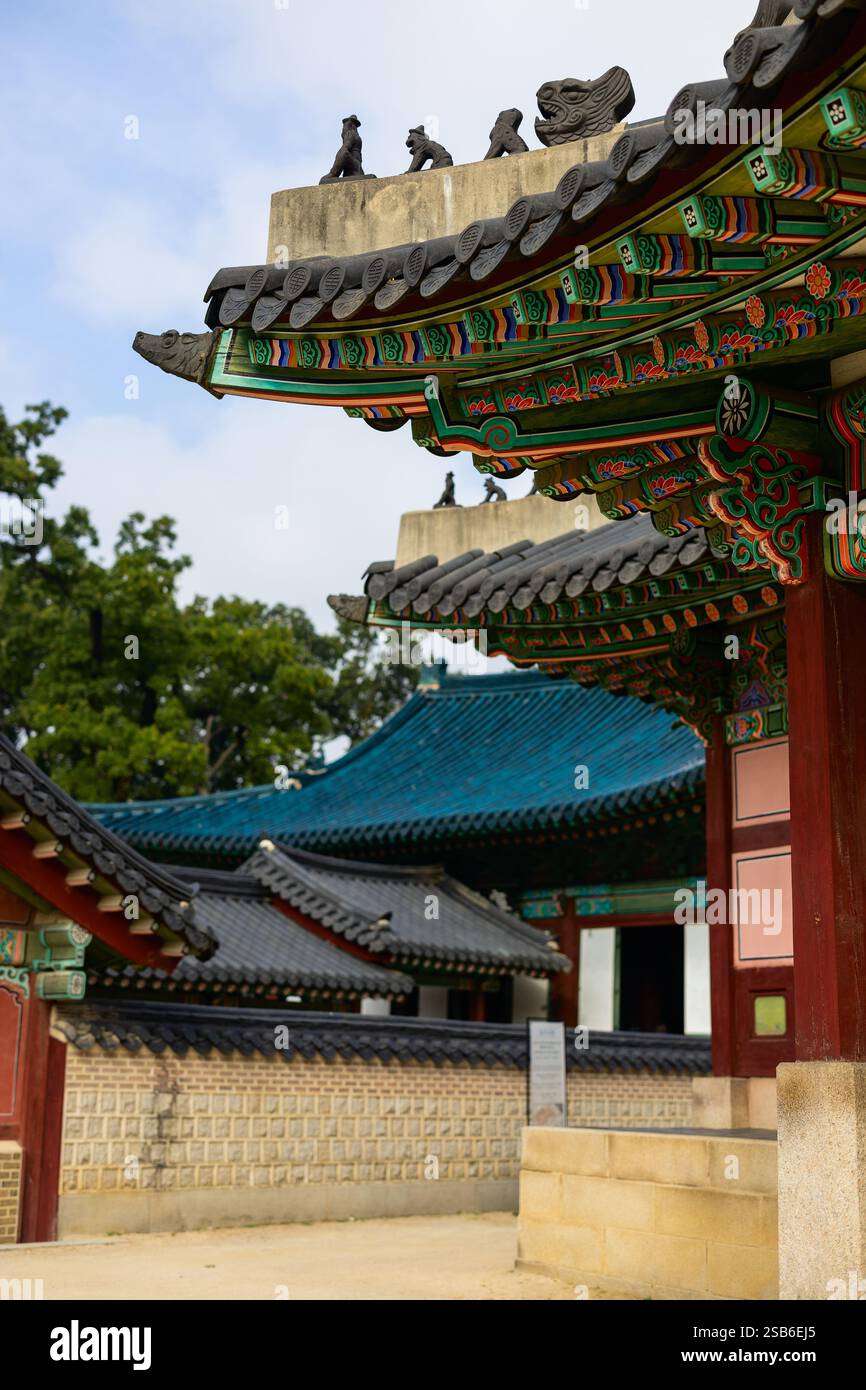 A traditional South Korean temple rooftop with decorative dancheong ...