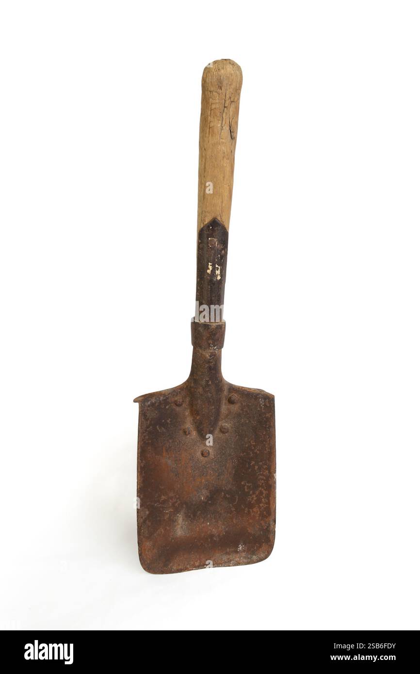 Short vintage military shovel with worn edges and rust pattern ...