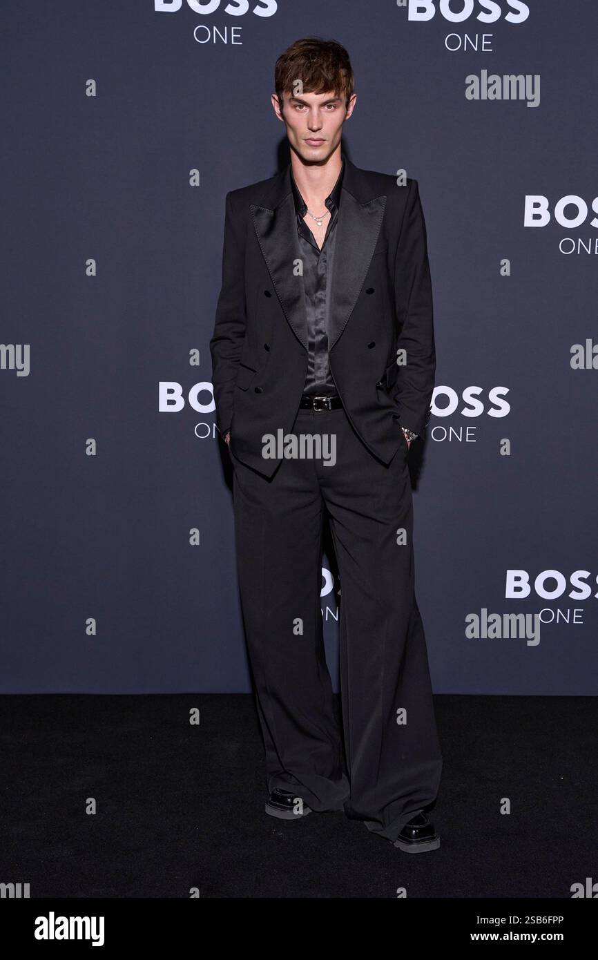 Kit Butler poses for photographers upon arrival at the BOSS One x David ...
