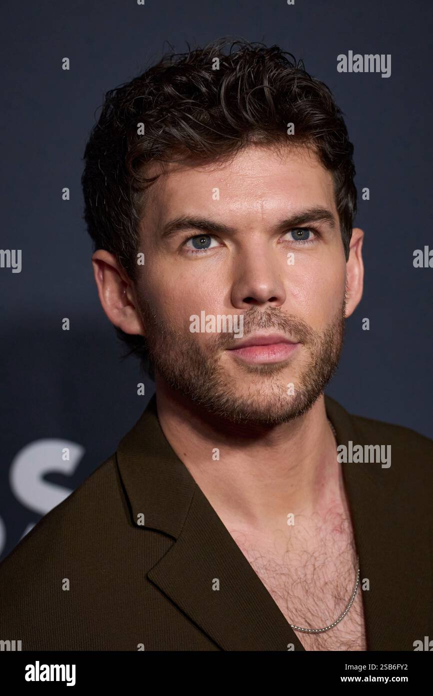 Luke Newton poses for photographers upon arrival at the BOSS One x ...