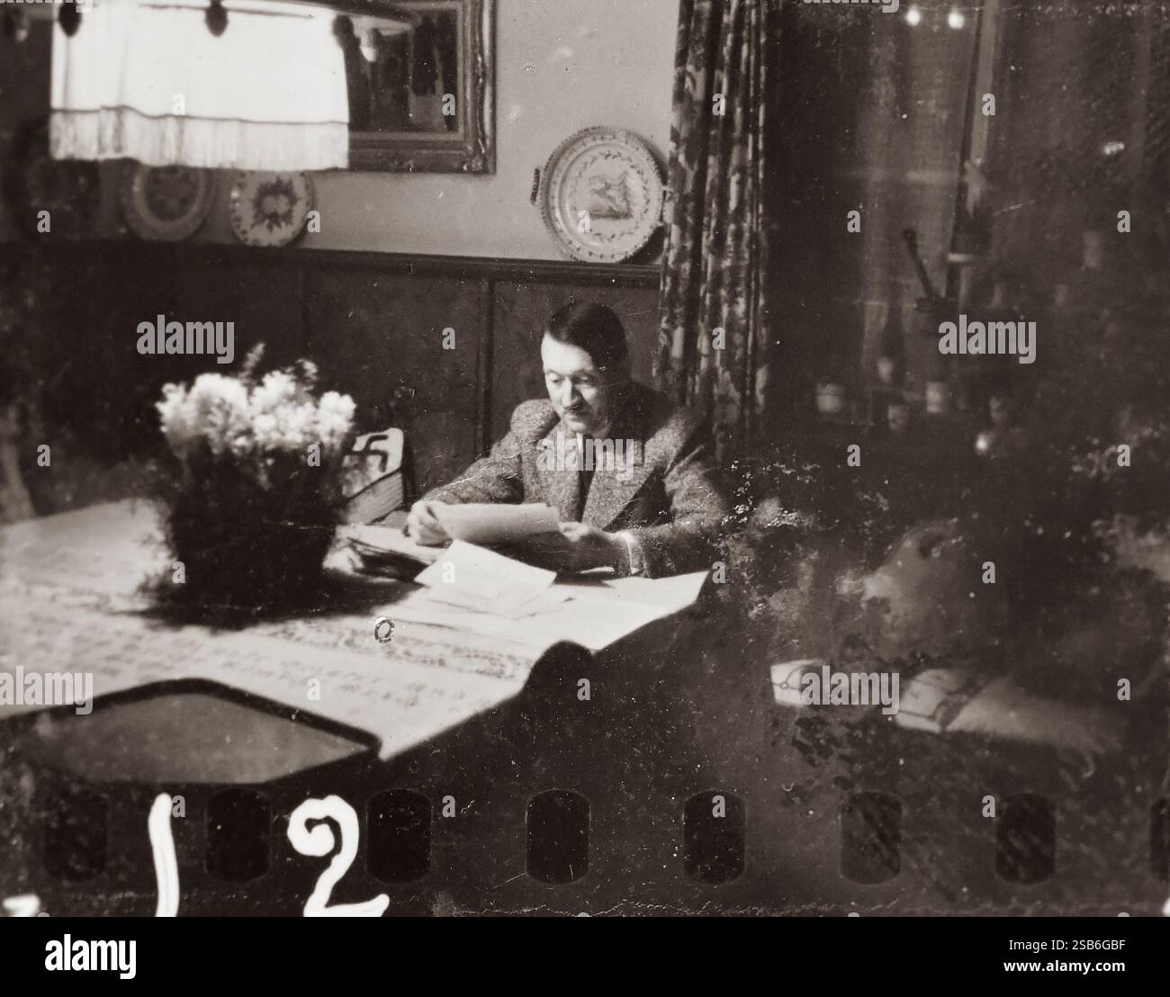 Nazi Party leader Adolf Hitler writing at a table Stock Photo - Alamy
