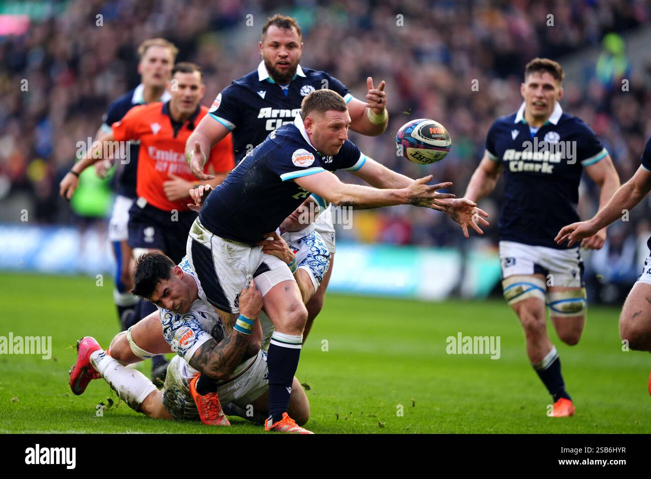 Scotland's Finn Russell is tackled during the Guinness Six Nations ...