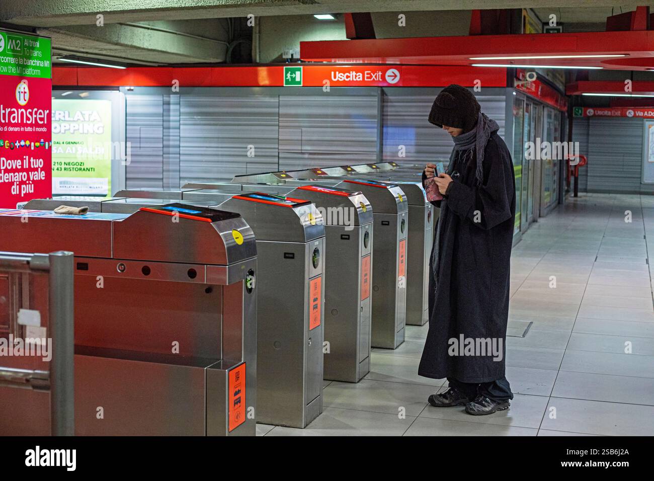 entrance through turnstiles in the Milan metro station in Italy in ...