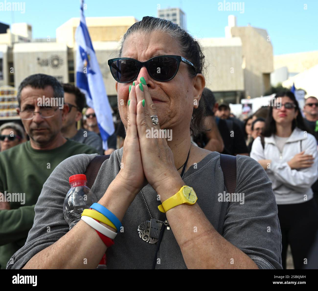 Tel Aviv, Israel. 01st Feb, 2025. People watch on a large screen in ...
