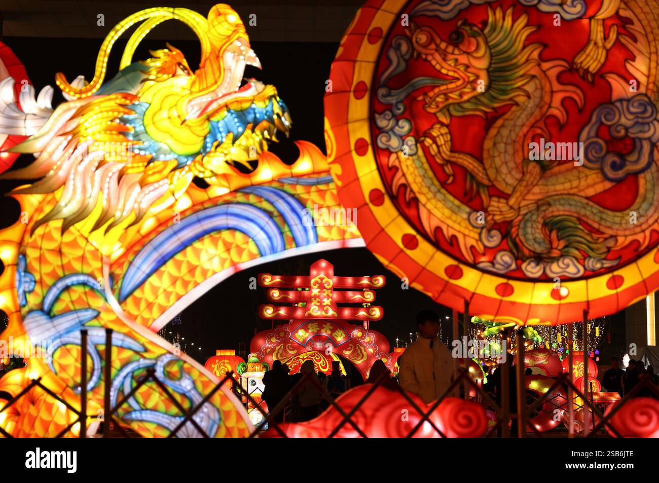 Beijing, China's Henan Province. 31st Jan, 2025. People watch lanterns ...