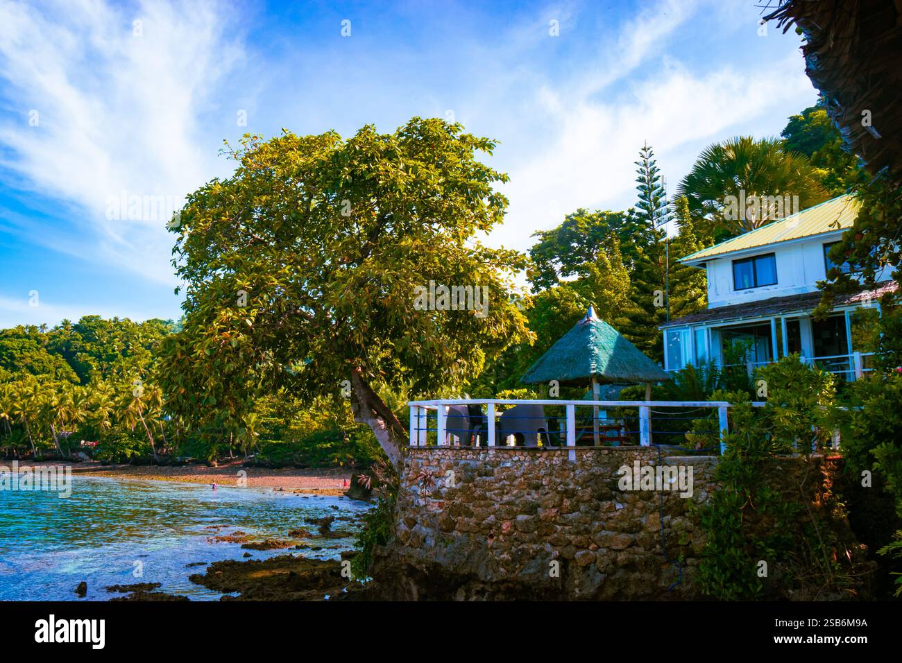 Cozy house by the rocky coast of the sea. Coco Cabana, Romblon Island ...