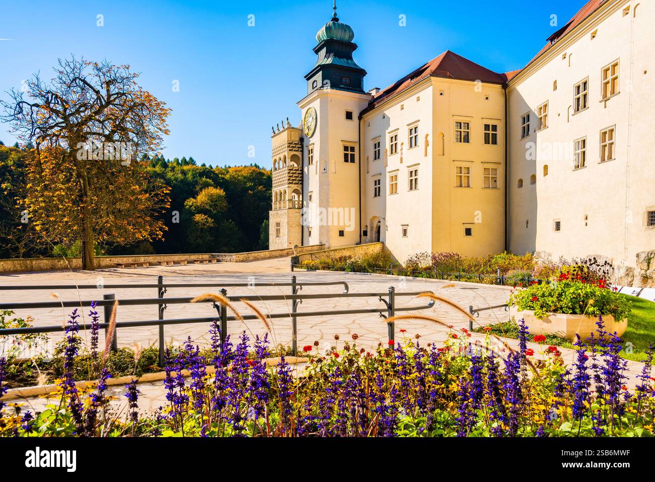 View of Pieskowa Skala castle in park with autumn fall colors of trees ...
