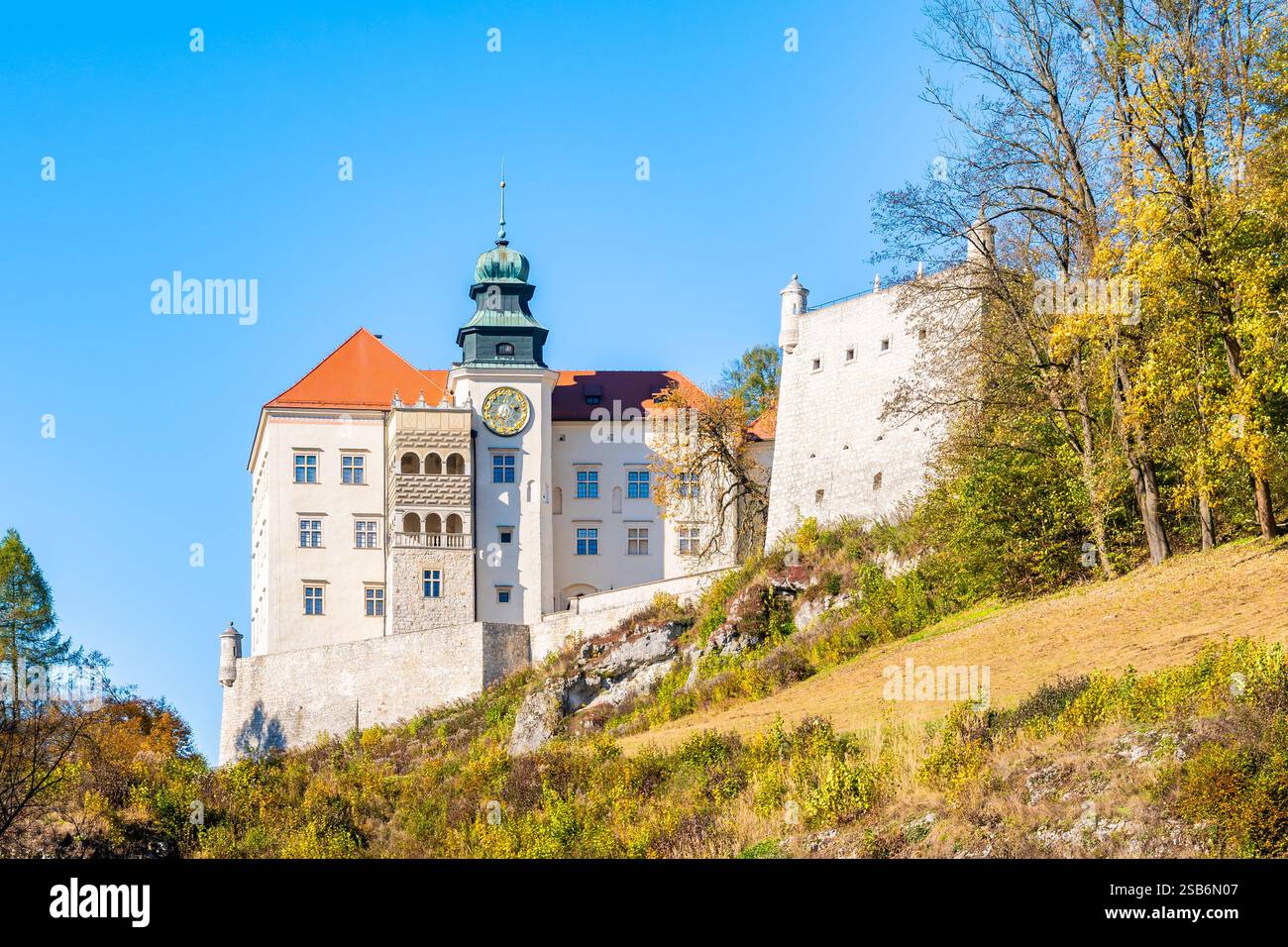 View of Pieskowa Skala castle in park with autumn fall colors of trees ...