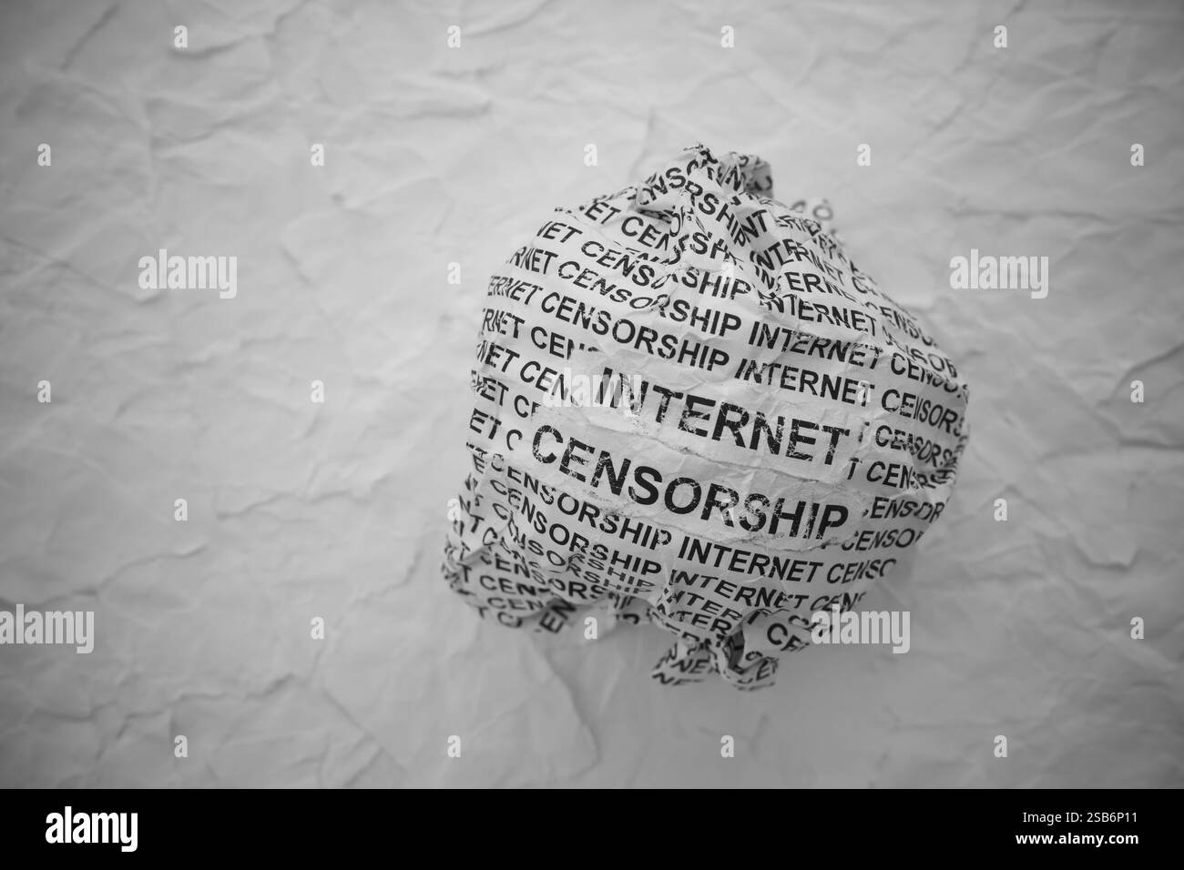 Crumpled paper ball with words Internet Censorship on torn white paper ...