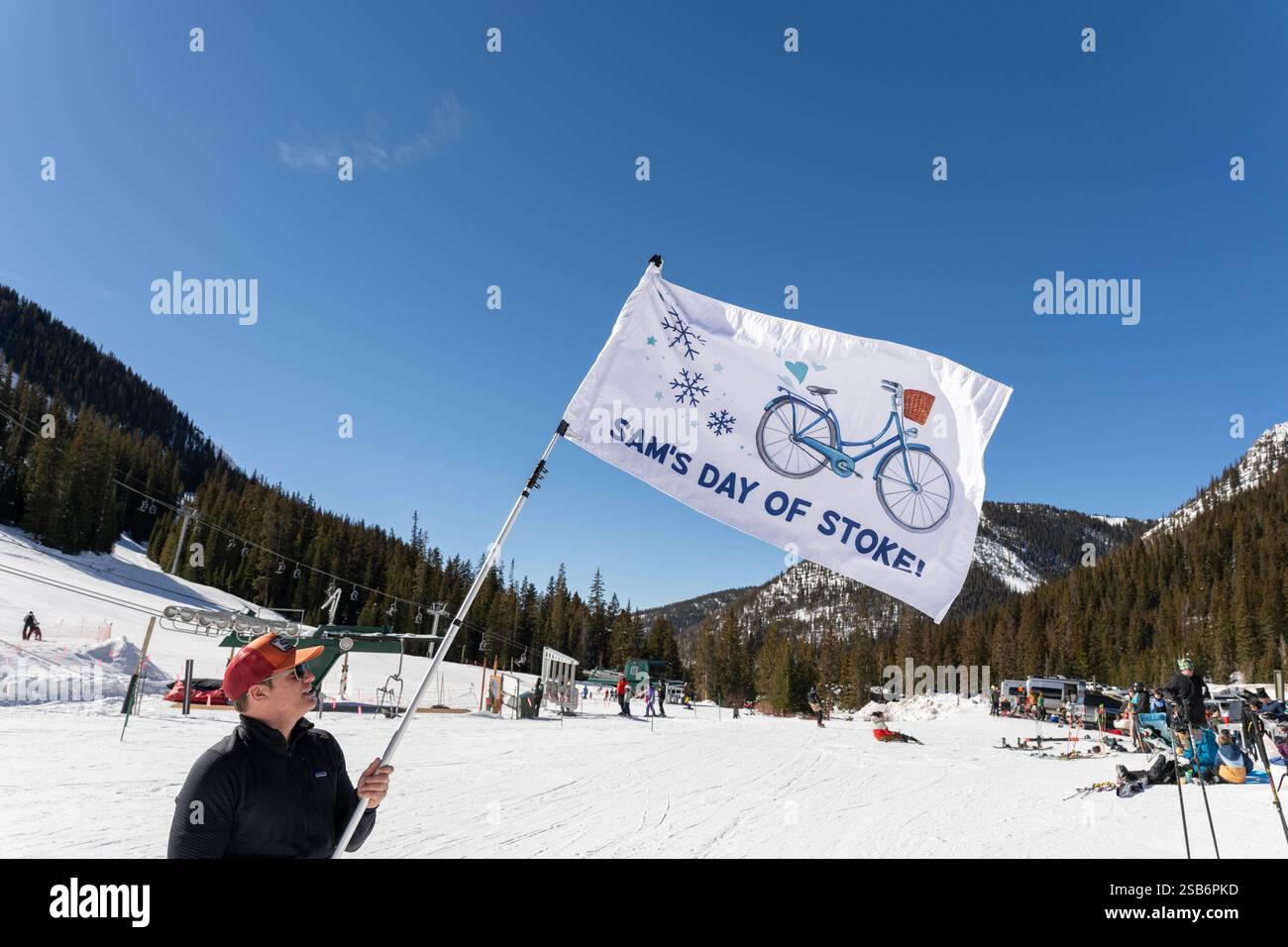 Keystone, Colorado, USA. 31st Jan, 2025. Jim Licko waves a ''Sam's Day ...