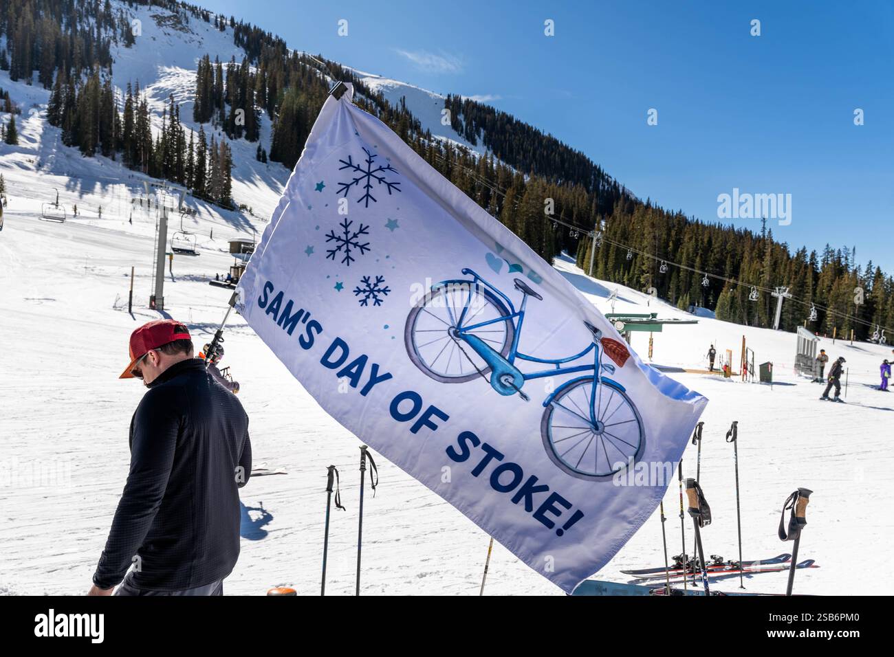 Keystone, Colorado, USA. 31st Jan, 2025. Jim Licko waves a ''Sam's Day ...