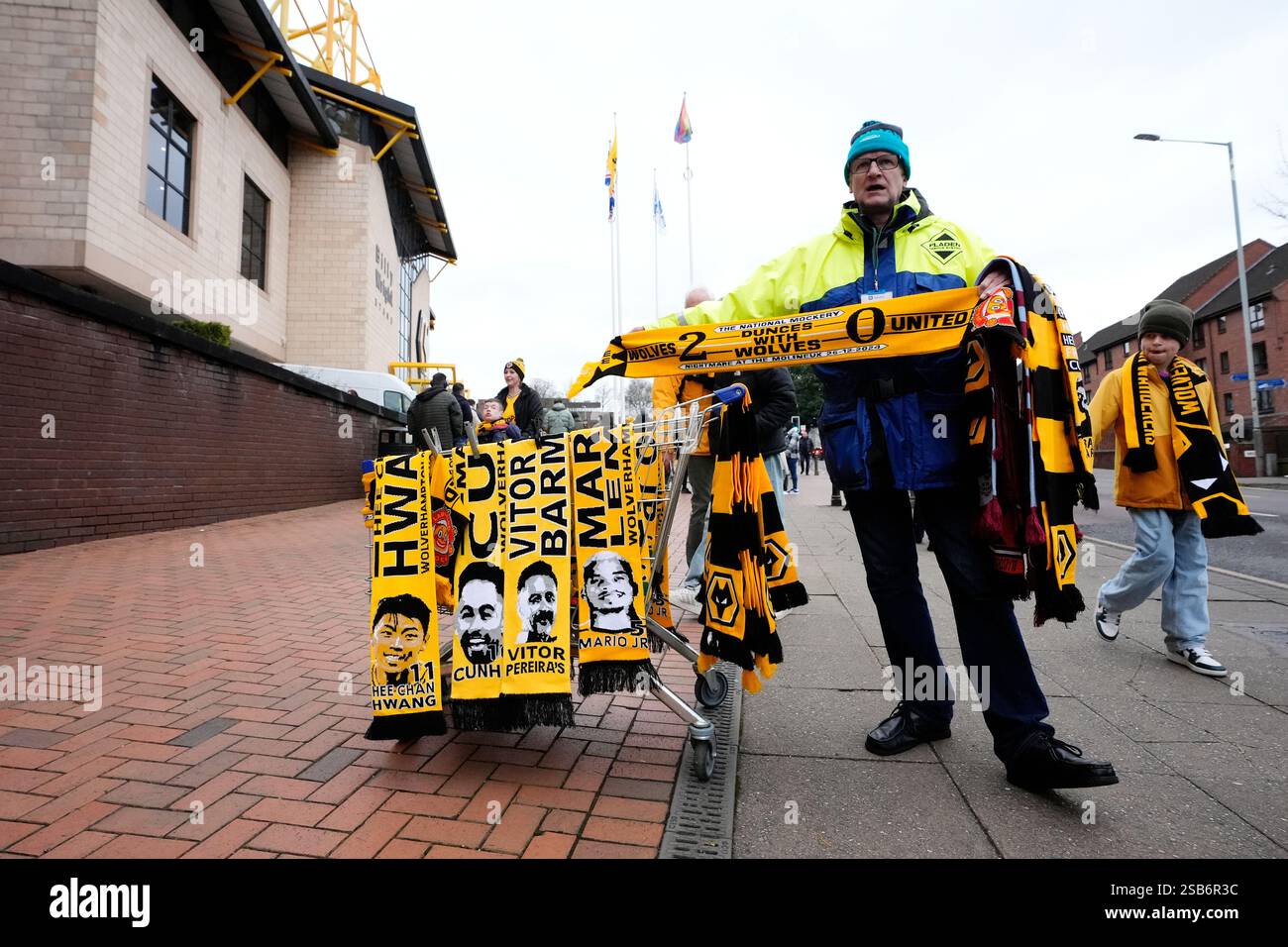 A street vendor selling Wolverhampton Wanderers scarves outside ...