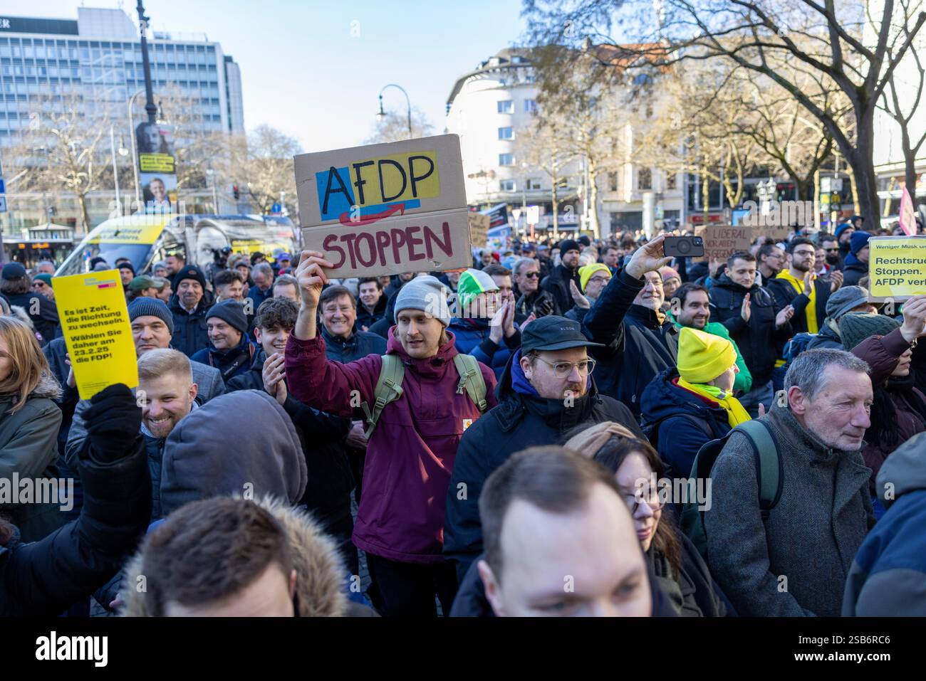 Cologne, Germany. 01st Feb, 2025. Counter-demonstrators hold up posters ...
