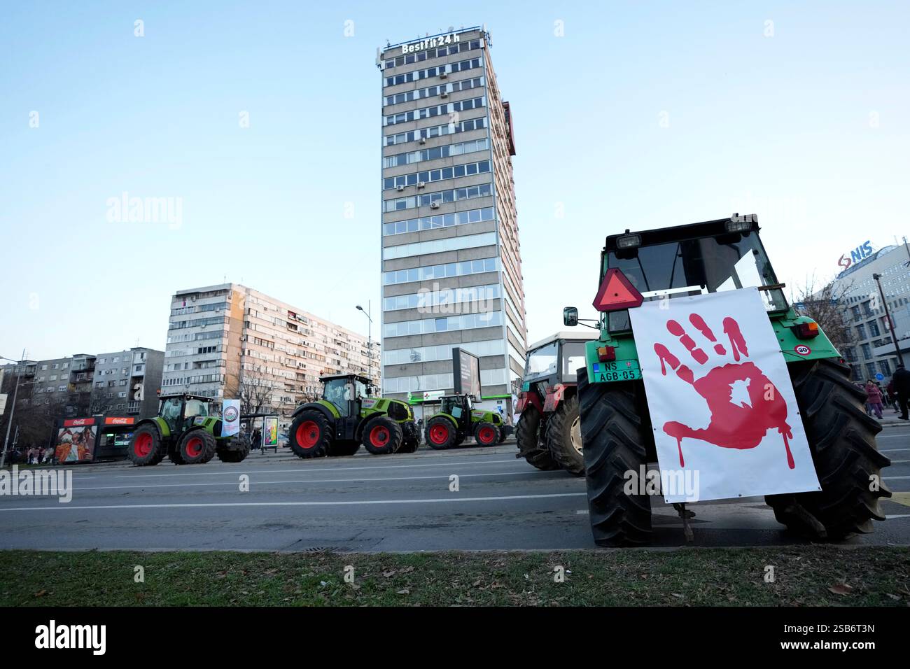 Tractors block a road during a protest over the collapse of a concrete ...