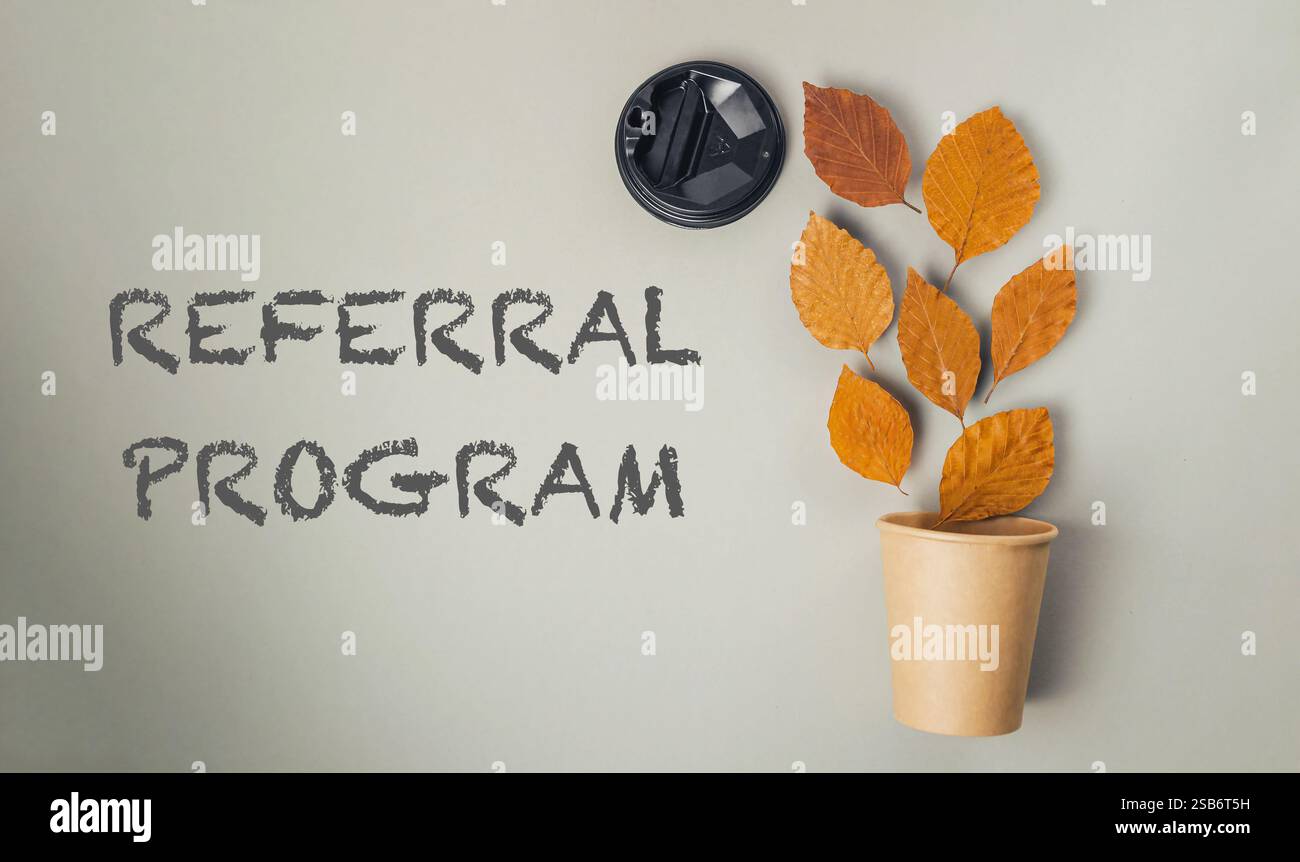 Potted plant with leaves is displayed with the words referral program ...