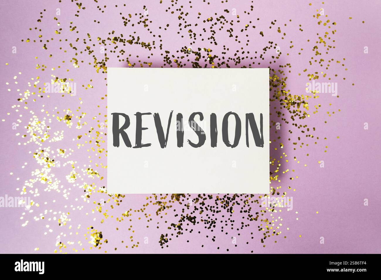 Revision is a word written on a white background with gold glitter. The ...