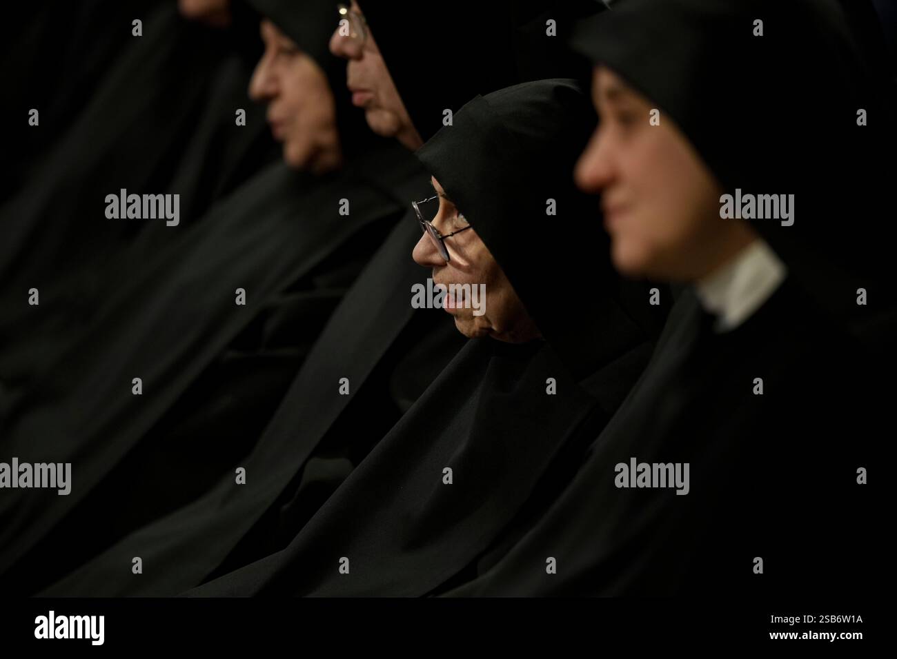 Nuns pray as they wait for the arrival of Pope Francis to preside over ...