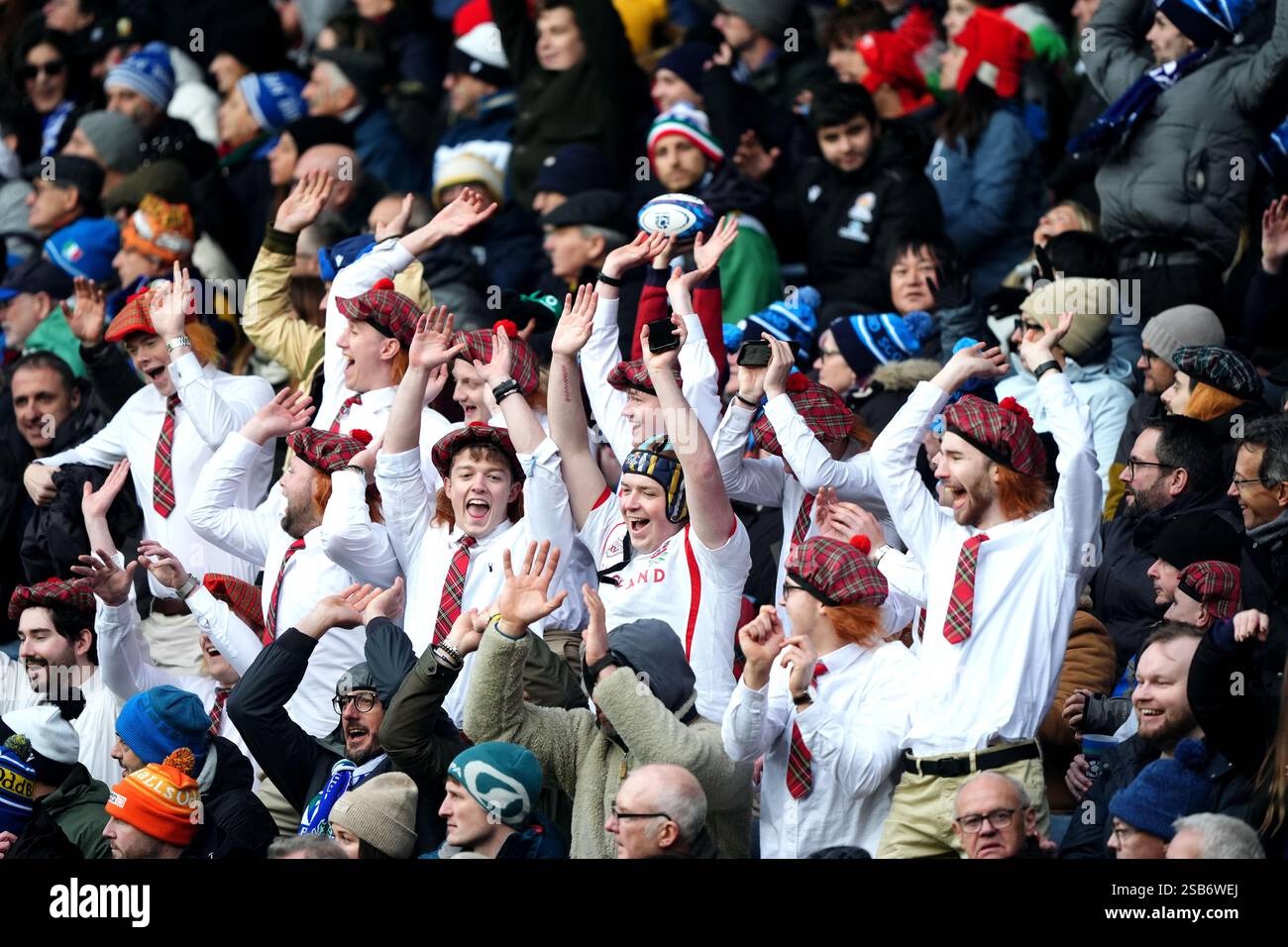 Fans take part in a Mexican wave during the Guinness Six Nations match ...