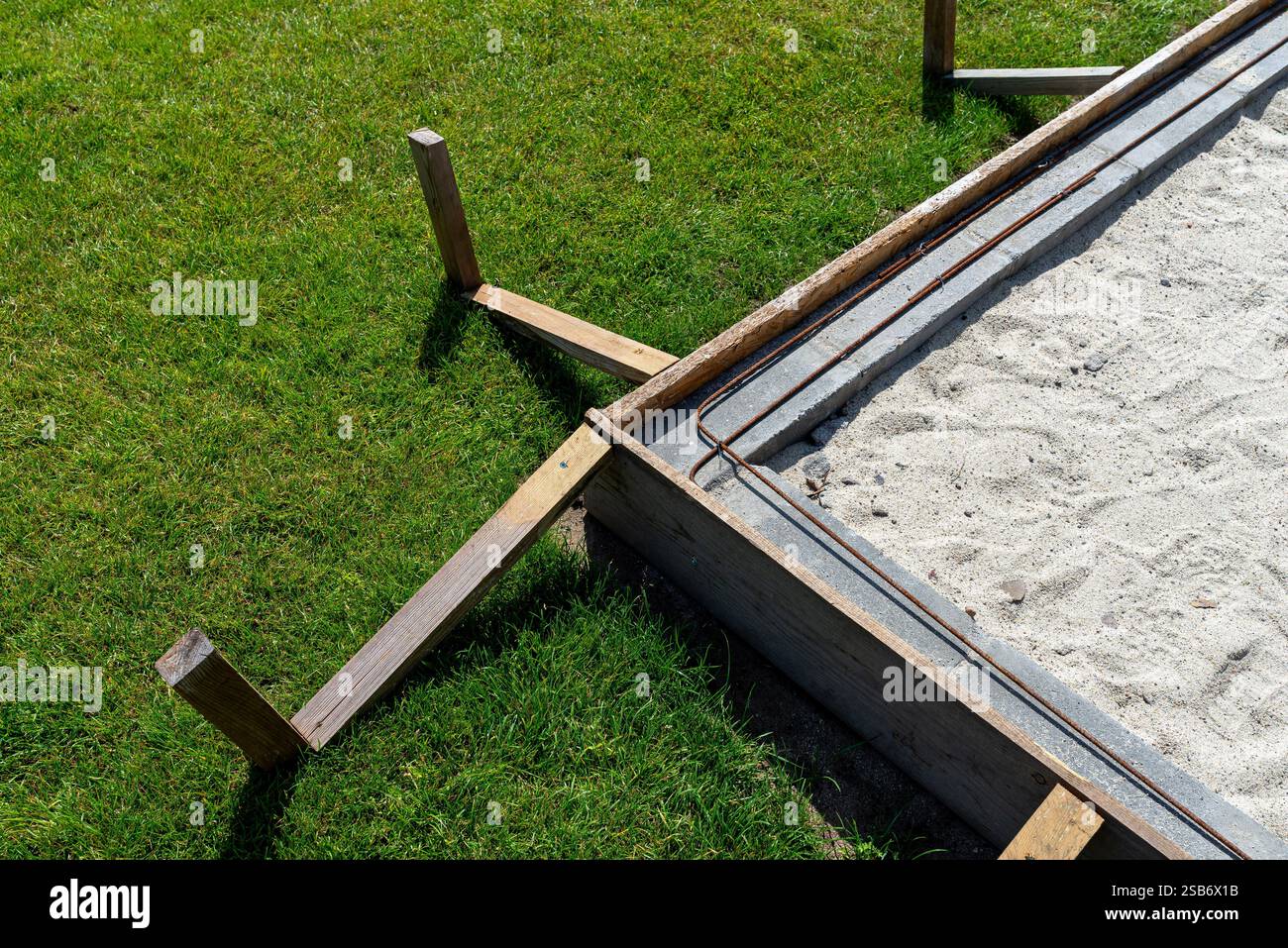 Reinforcing bars lying on concrete bricks, preparation for pouring ...
