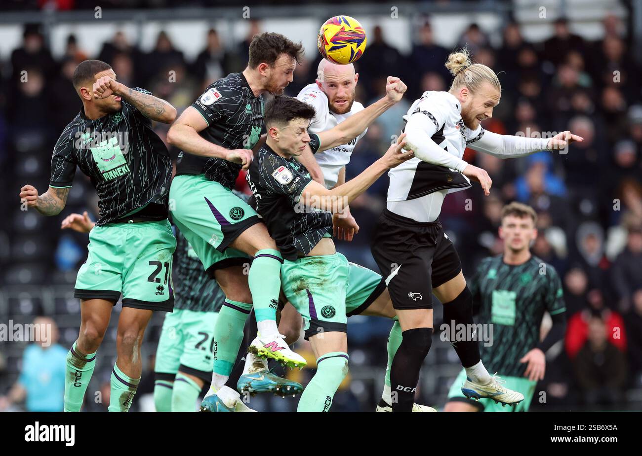 Derby County's Matt Clarke and Lars-Jorgen Salvesen challenge for the ...