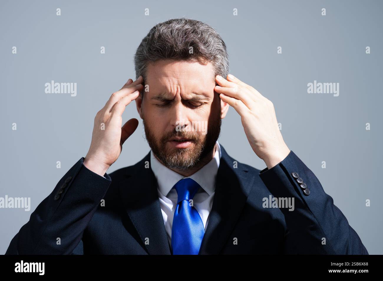 Tired man having a terrible headache. Exhausted man feeling unhealthy ...