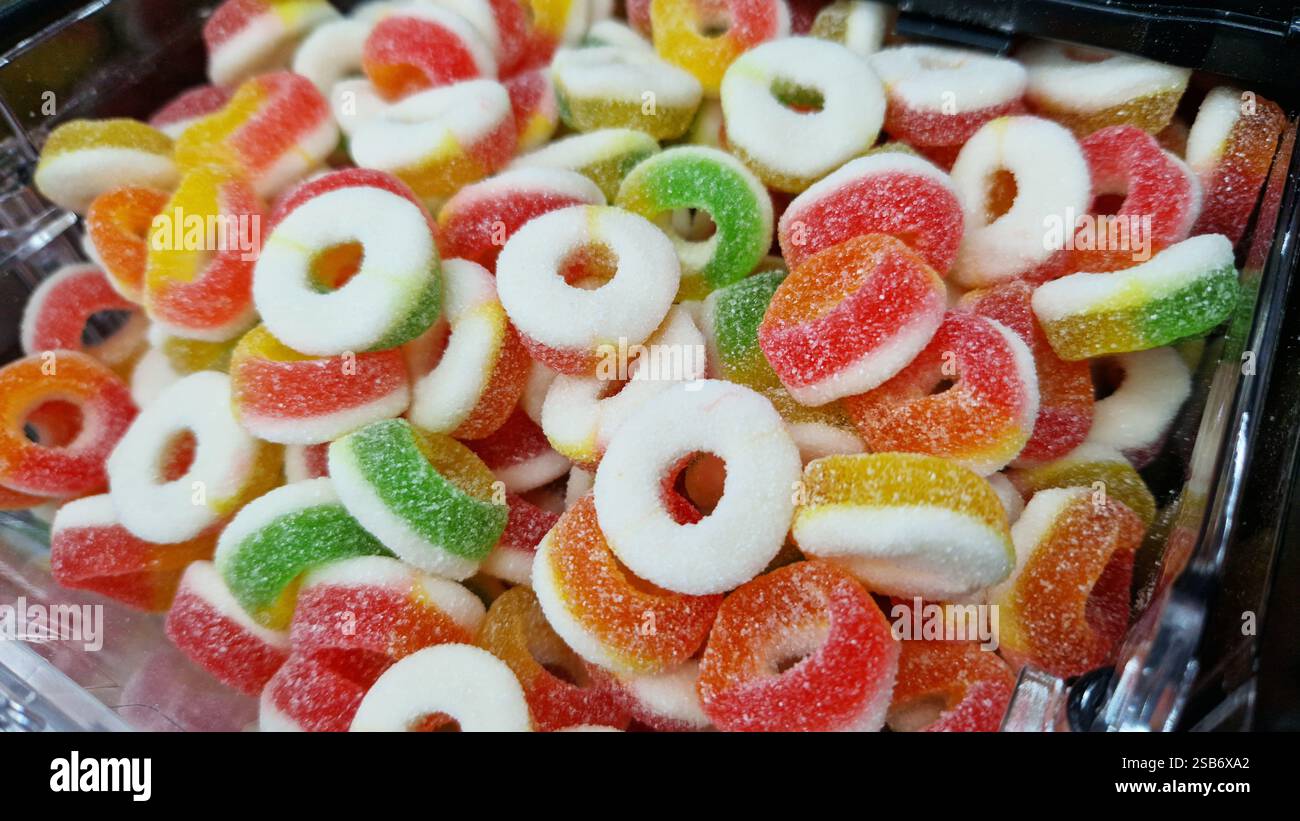 Colored jelly rings with sugar. Jelly candies close-up. Sweets ...