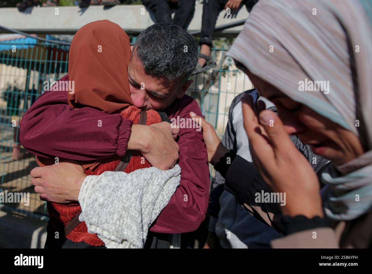 A freed Palestinian prisoner hugs a relative as he arrives in the Gaza ...