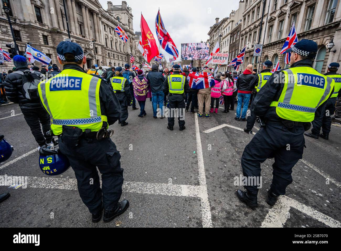 London, UK. 1 Feb 2025. The police keep a buffer zone as they are wary ...