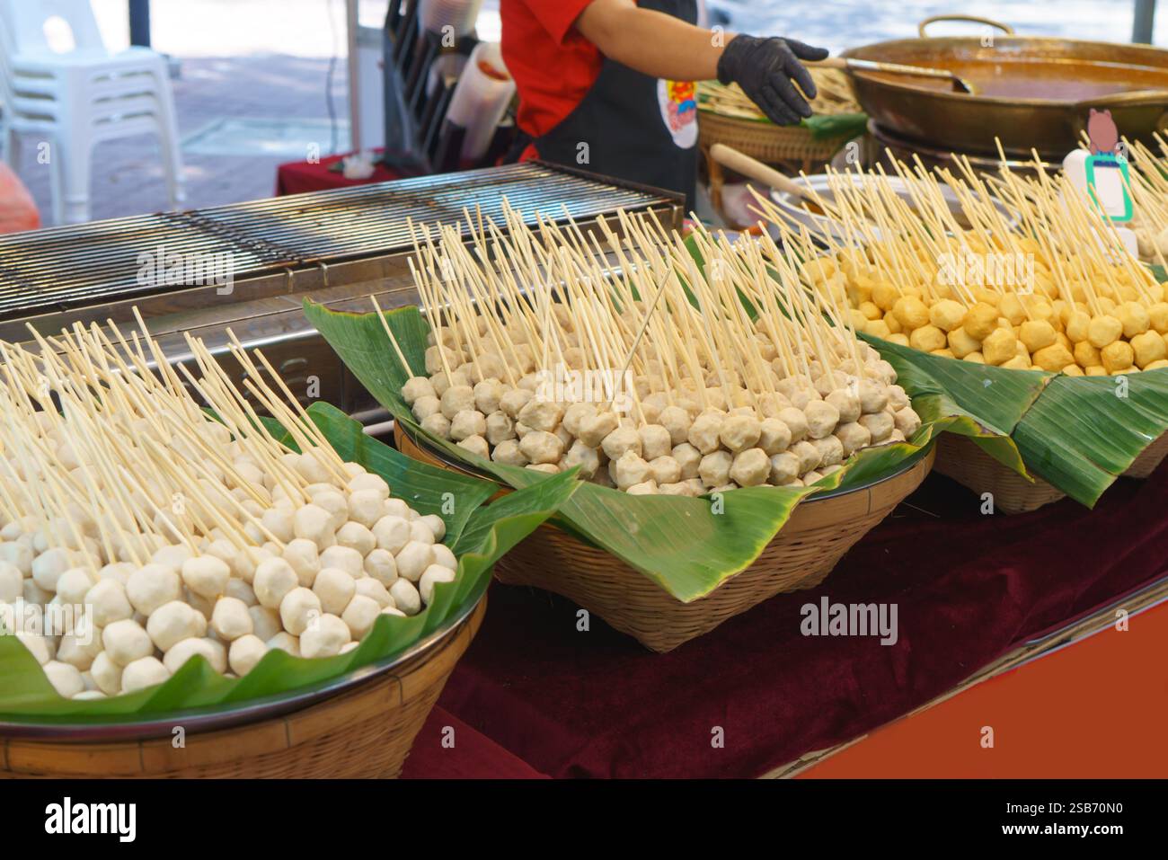 vibrant display of traditional grilled meatball skewers neatly arranged ...