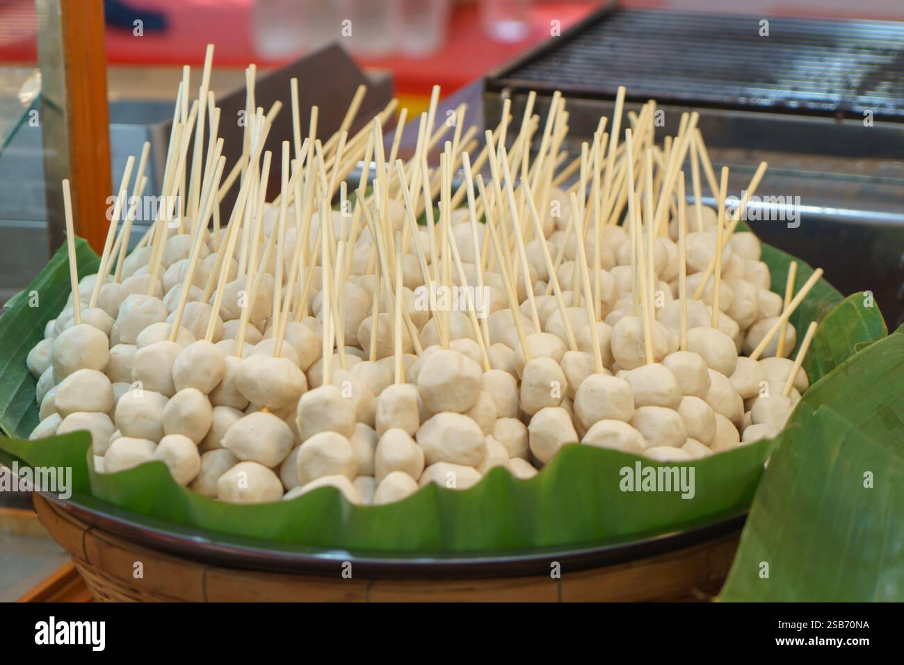 vibrant display of traditional grilled meatball skewers neatly arranged ...