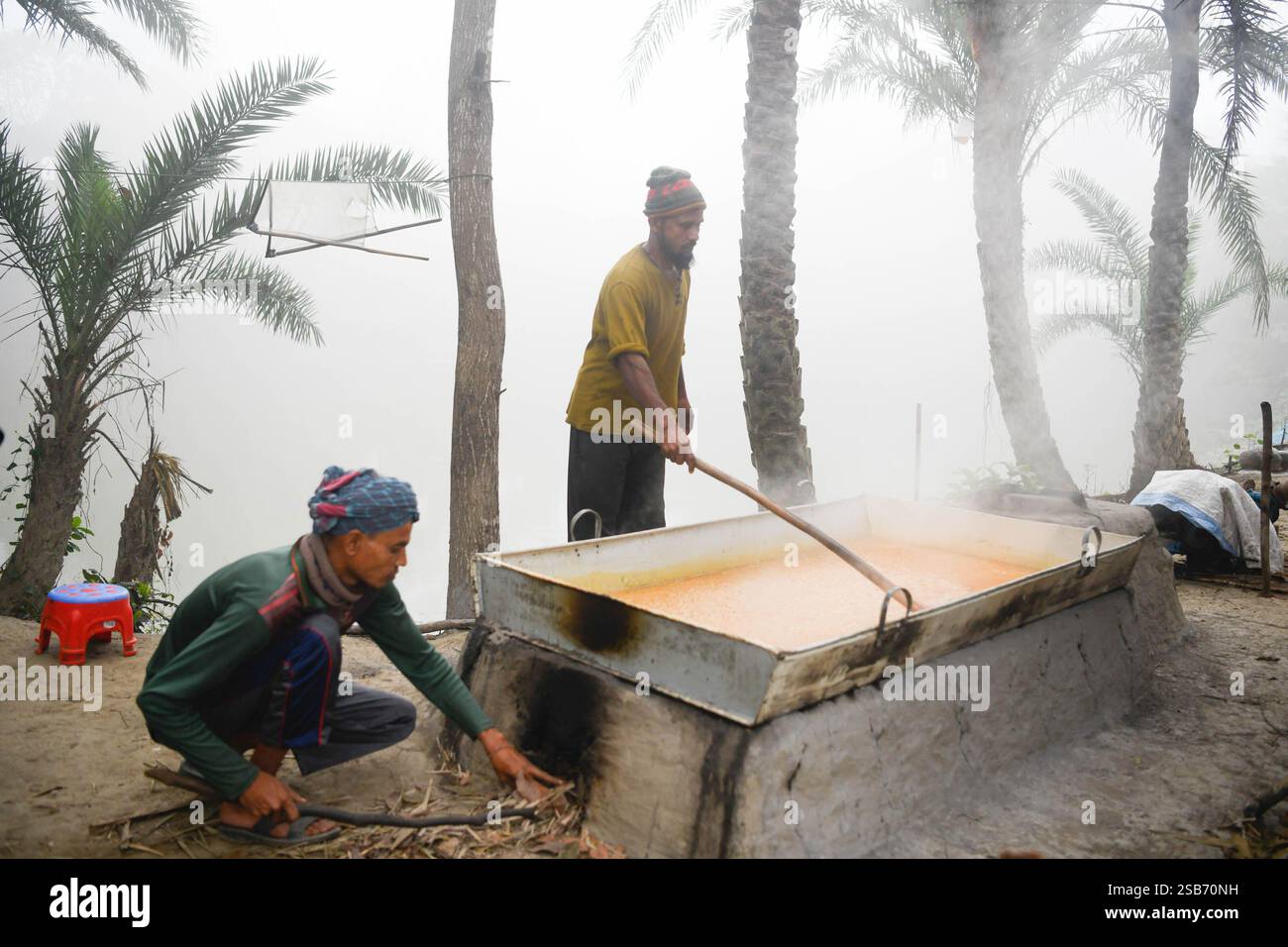 Workers prepare date jaggery after collecting juice from date palm trees at Faridpur. (Photo by ...
