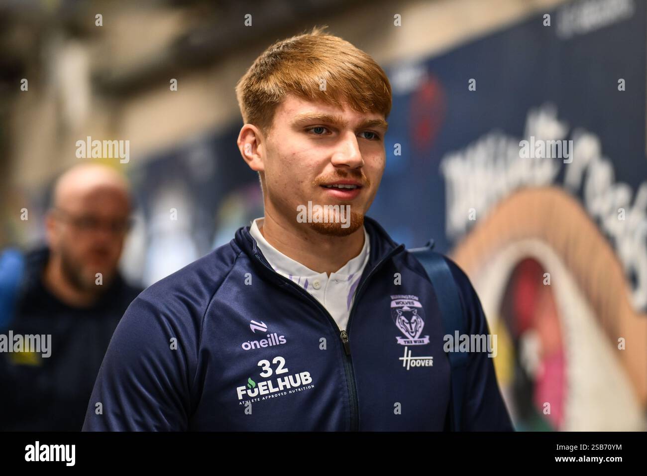 Nolan Tupaea of Warrington Wolves arrives ahead of Toby King's ...
