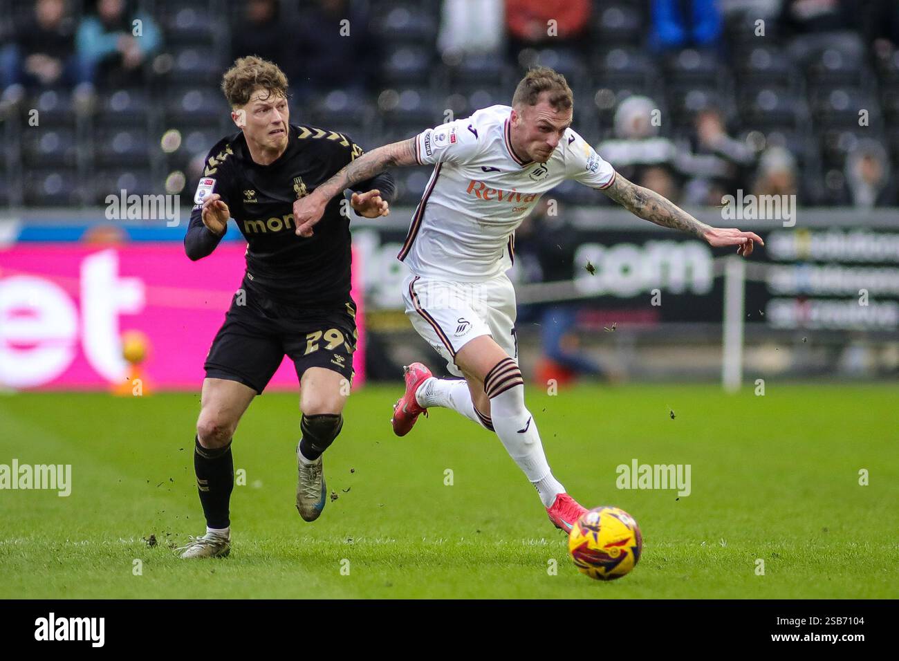 Josh Tymon of Swansea City under pressure from Victor Torp of Coventry ...