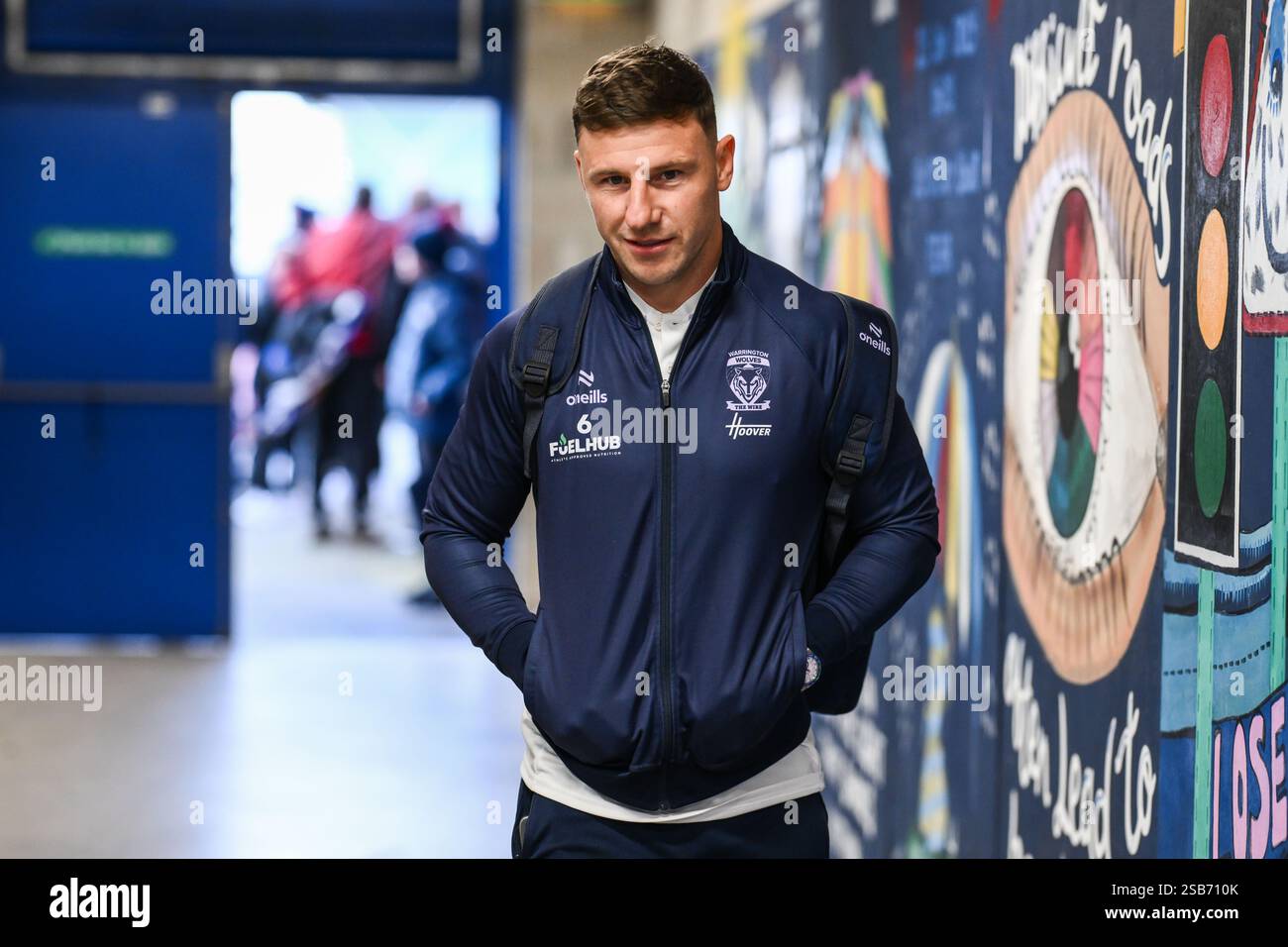 George Williams of Warrington Wolves arrives ahead of Toby King's ...
