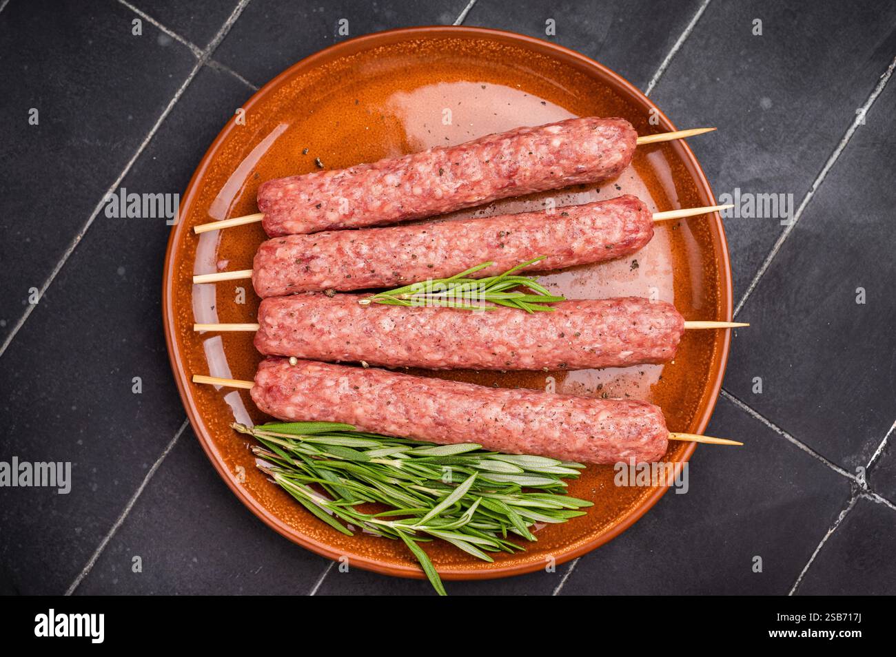 Raw Cevapcici skewers, Cevapi sausages from mince beef and pork meat ...