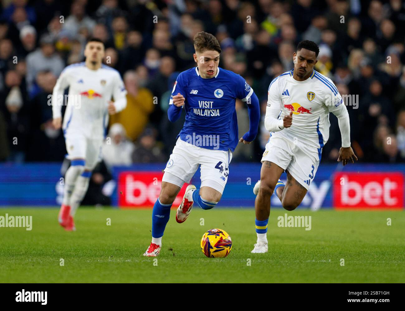 Cardiff City's Cian Ashford (left) and Leeds United's Junior Firpo ...