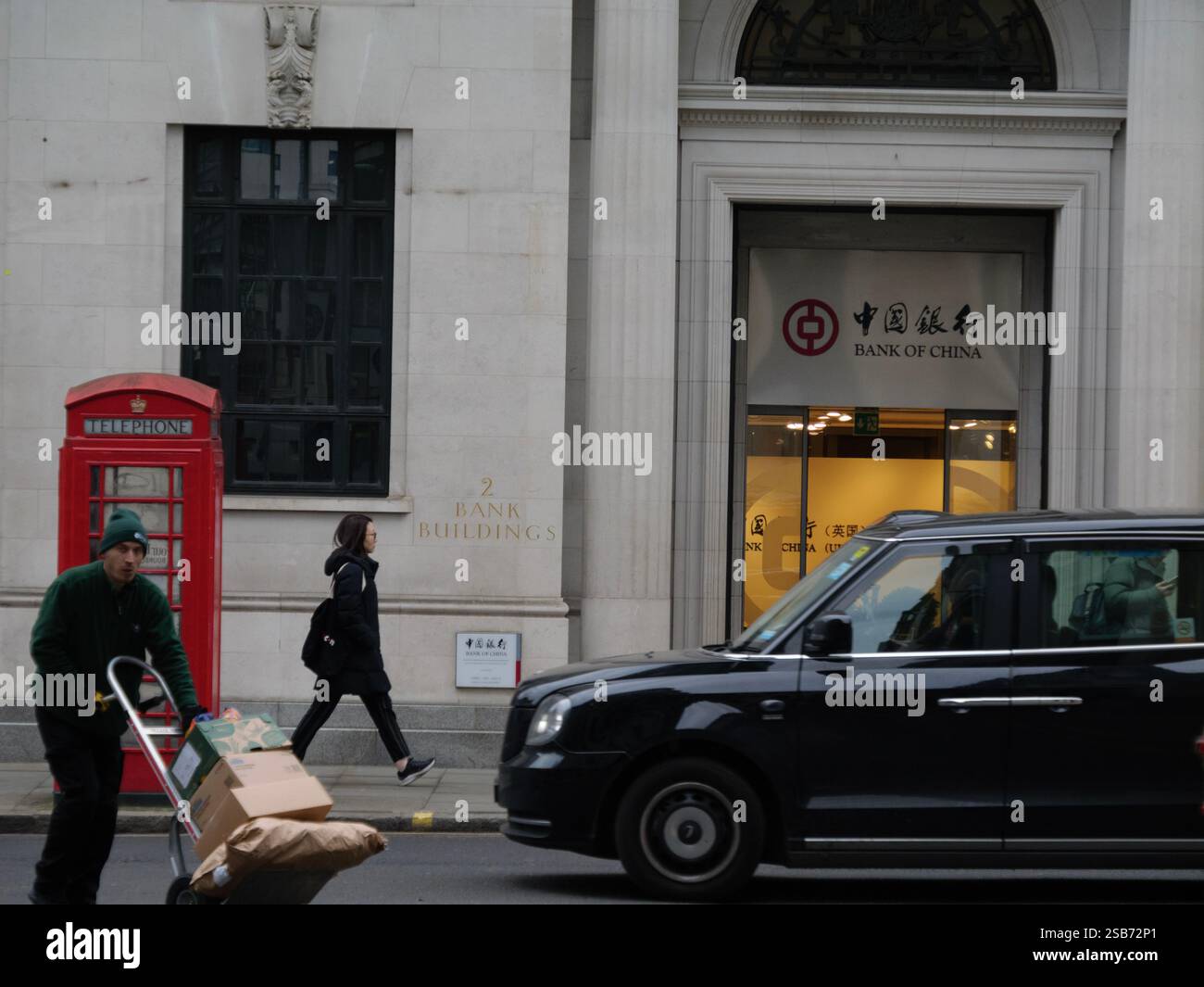 Pedestrians and taxi pass the Bank of China branch Moorgate London UK ...