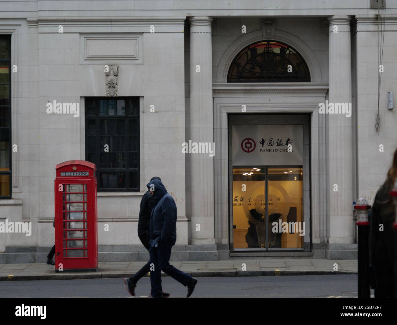 Pedestrians walk past the Bank of China branch Moorgate London UK with ...