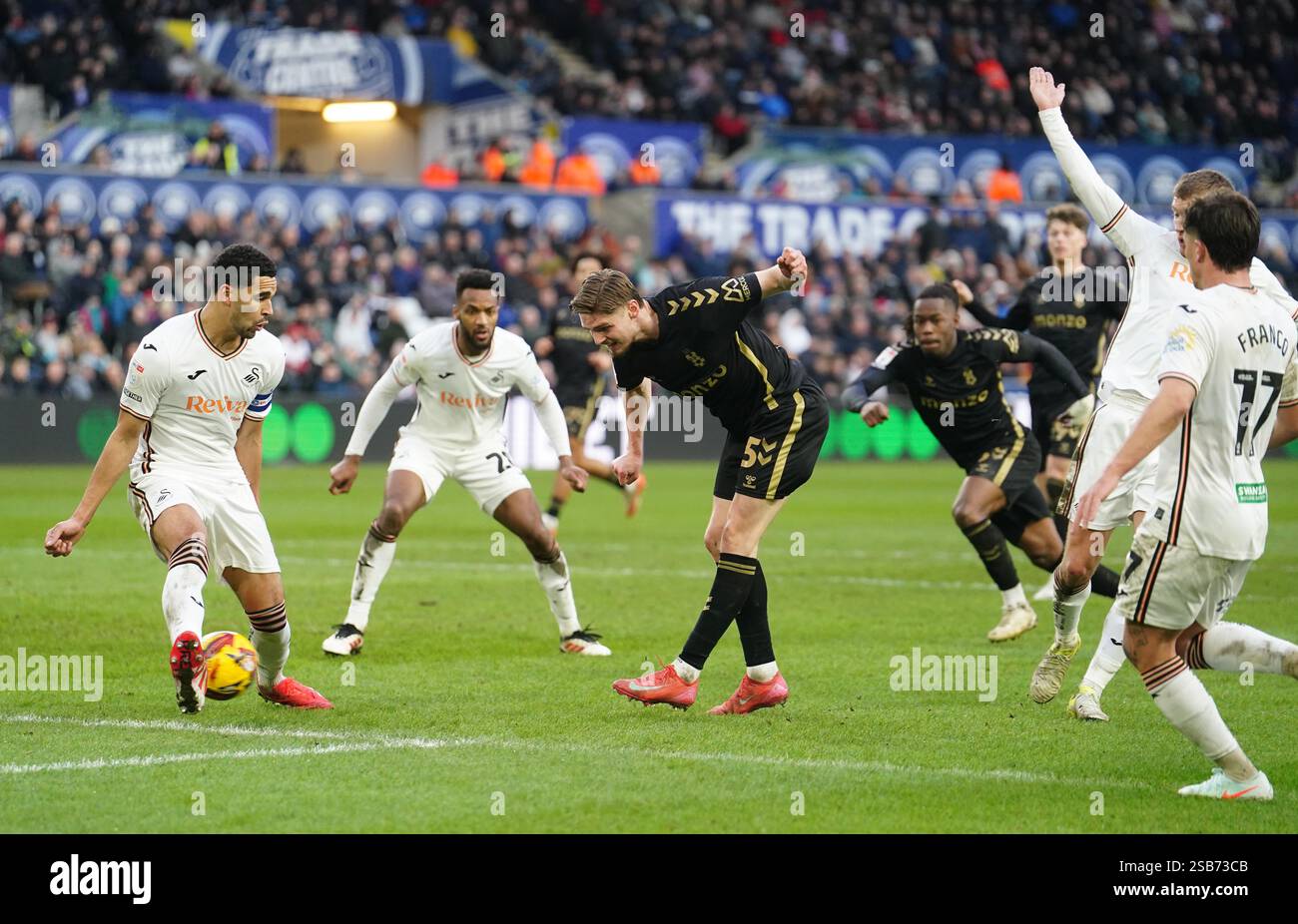Coventry City's Jack Rudoni (centre) heads wide of the goal during the ...
